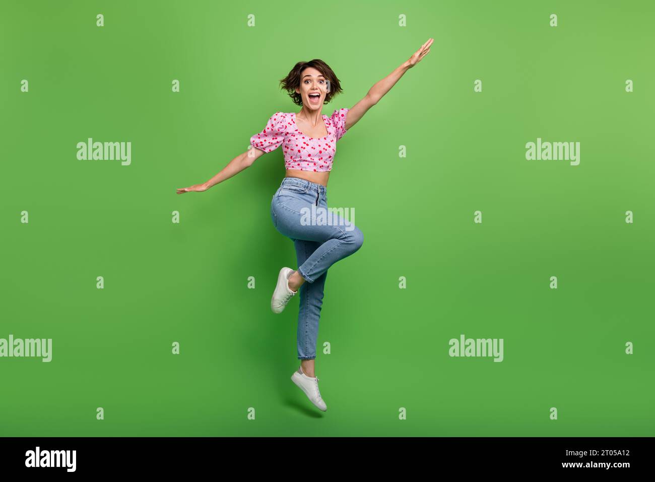 Full size photo of pretty young girl jumping run activity dressed ...