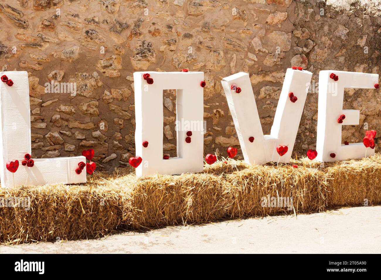 Decoration with huge white letters that make up the word "LOVE" and ...