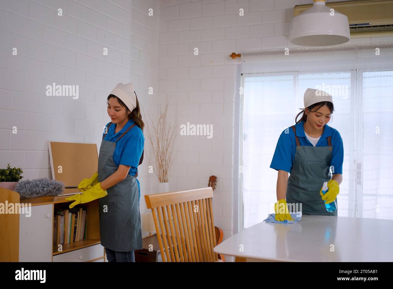 House keeper clean living room. Cleaning service and house keeping ...