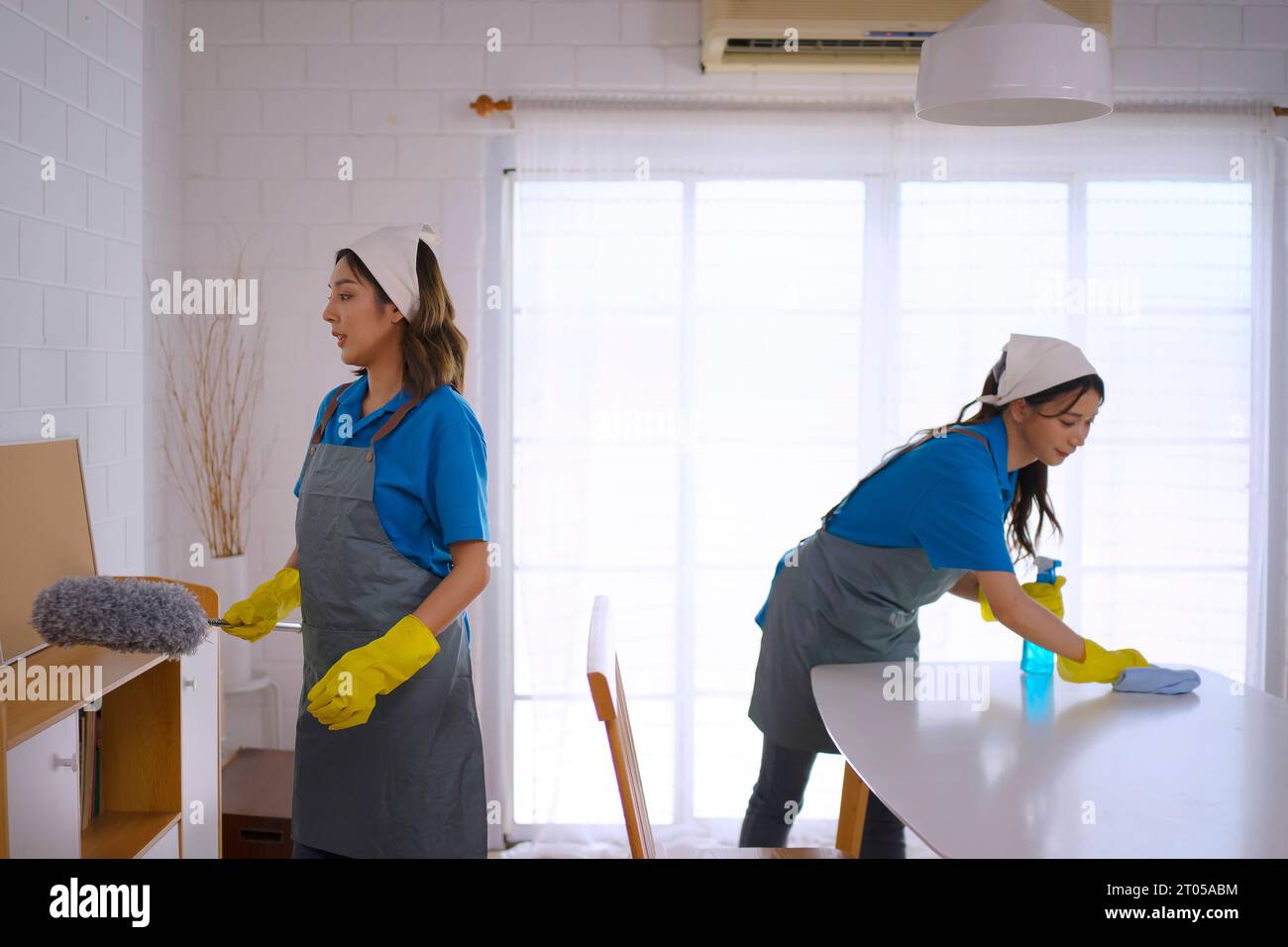 House keeper clean living room. Cleaning service and house keeping ...