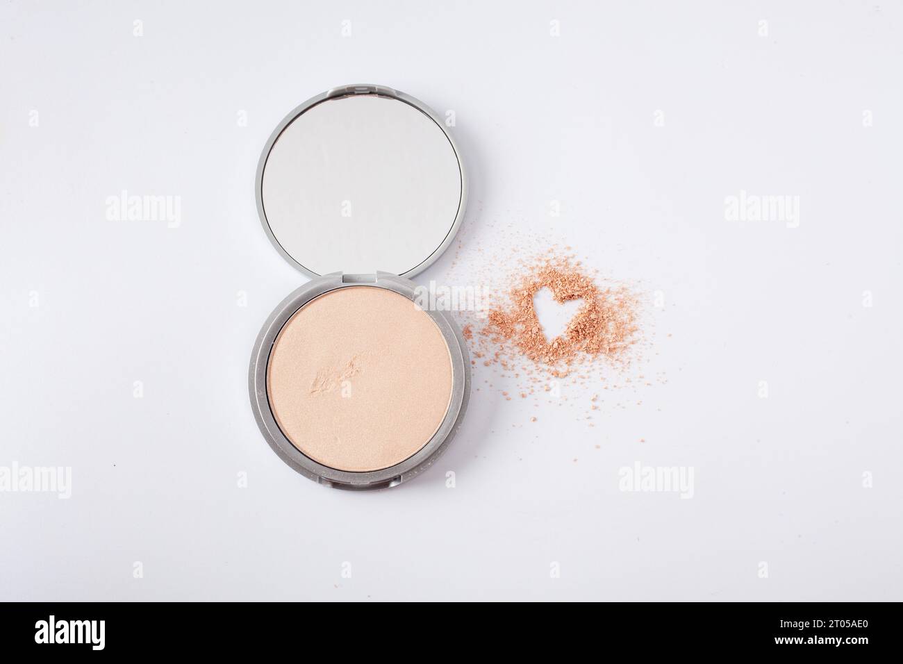 Beautiful eyeshadow palette on white with crushed sample heart shape ...