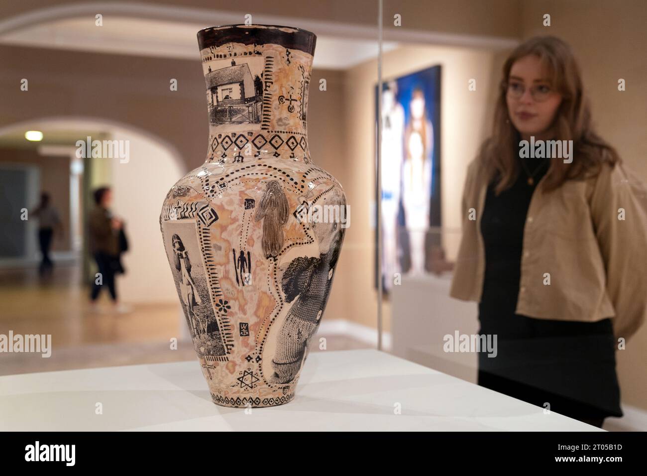 A woman views 'Vase Using My Family' by Grayson Perry in the Real ...