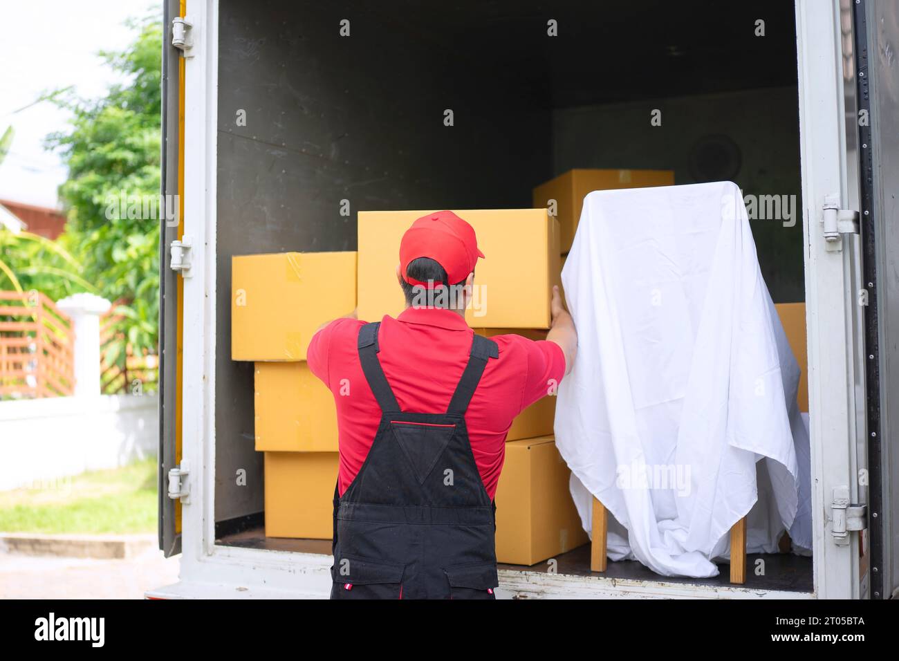 Delivery man move items to the house. Service and delivery concept ...