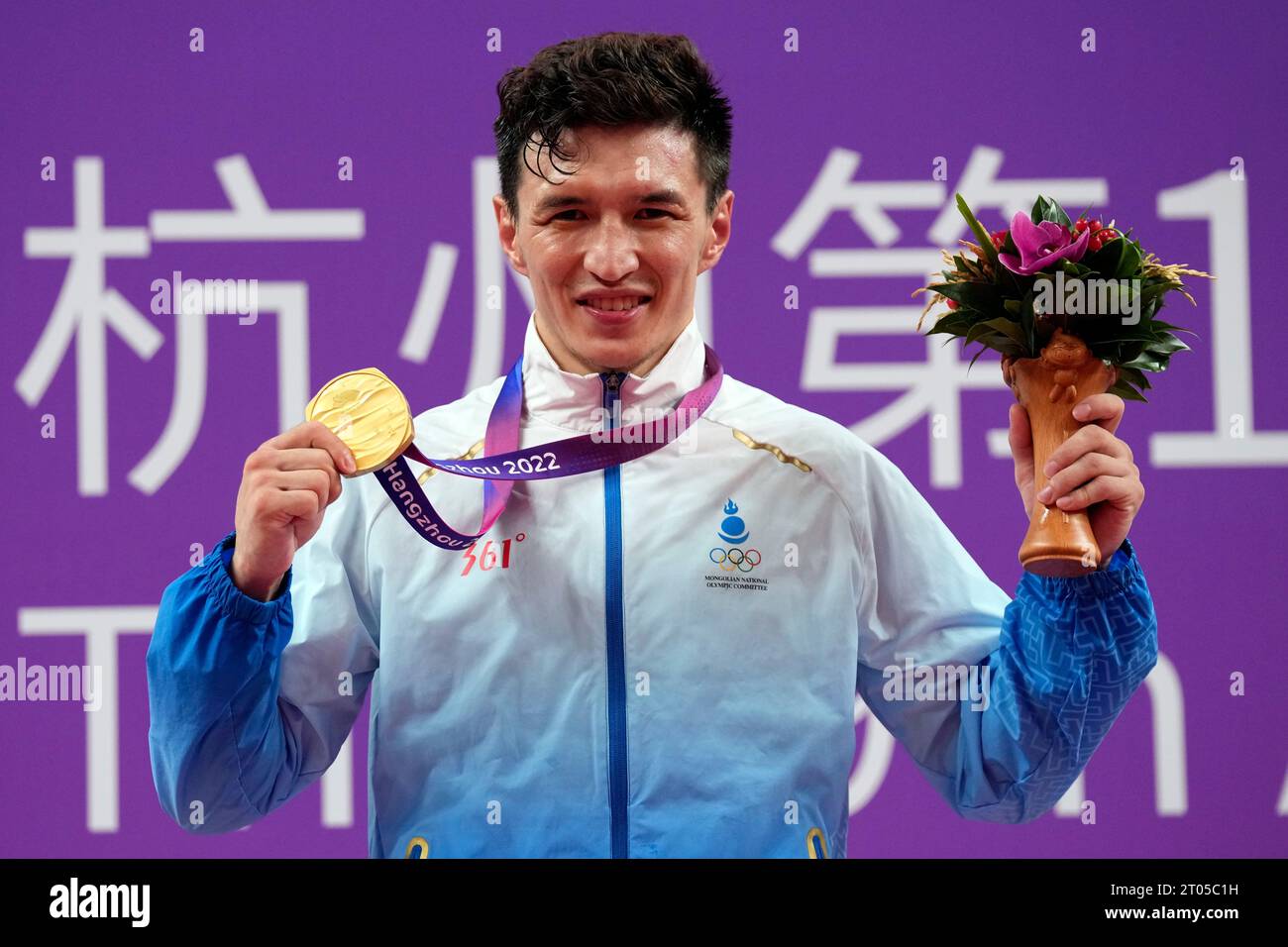 Gold medalist Chinzorig Baatarsukh of Mongolia poses for photographers ...