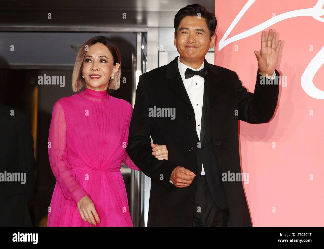 Hong Kong actor Chow Yun-fat and his wife Jasmine Tan arrive to attend the opening ceremony of ...