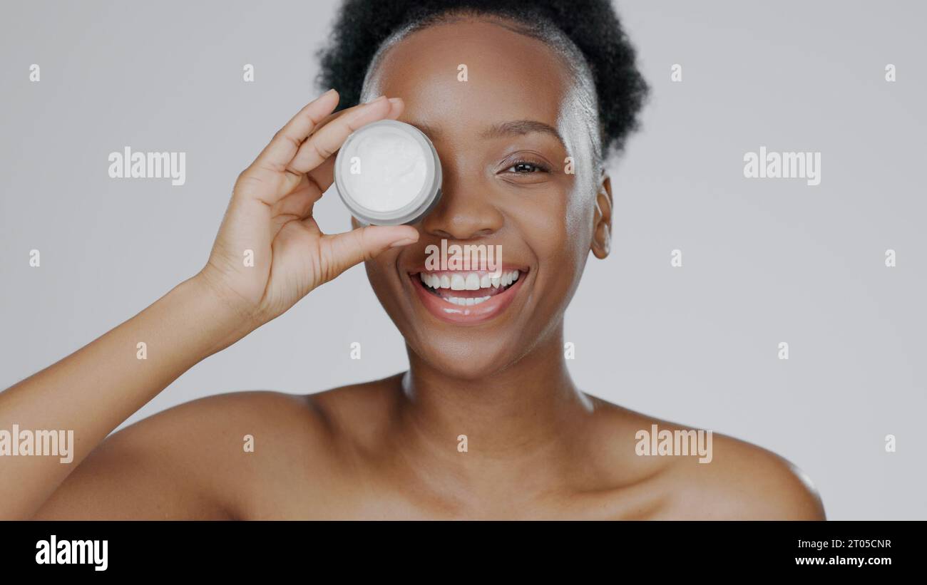 Happy black woman, portrait and face cream for skincare, beauty or ...