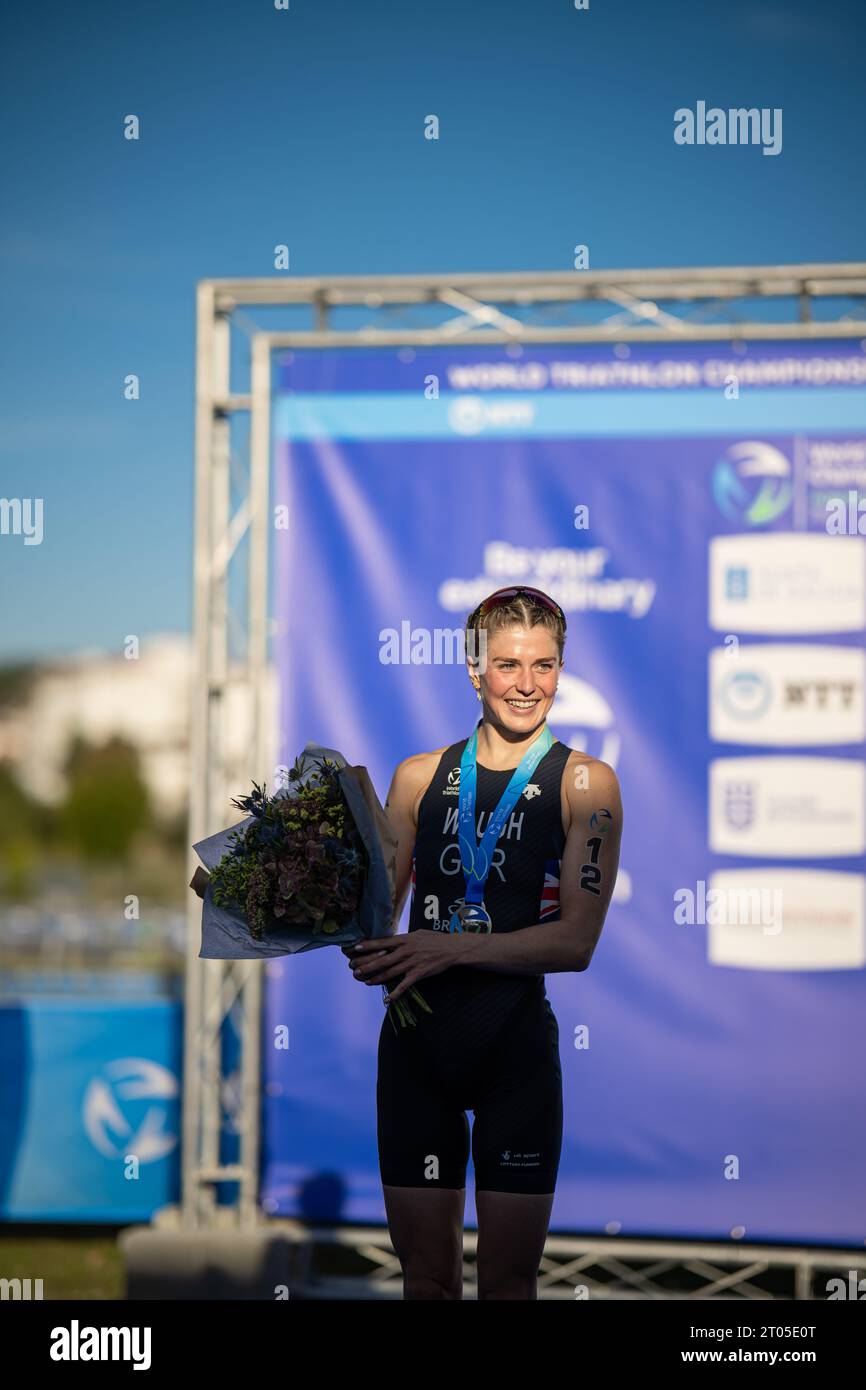 Kate Waugh on the podium with the awards ceremony in the 2023 World ...