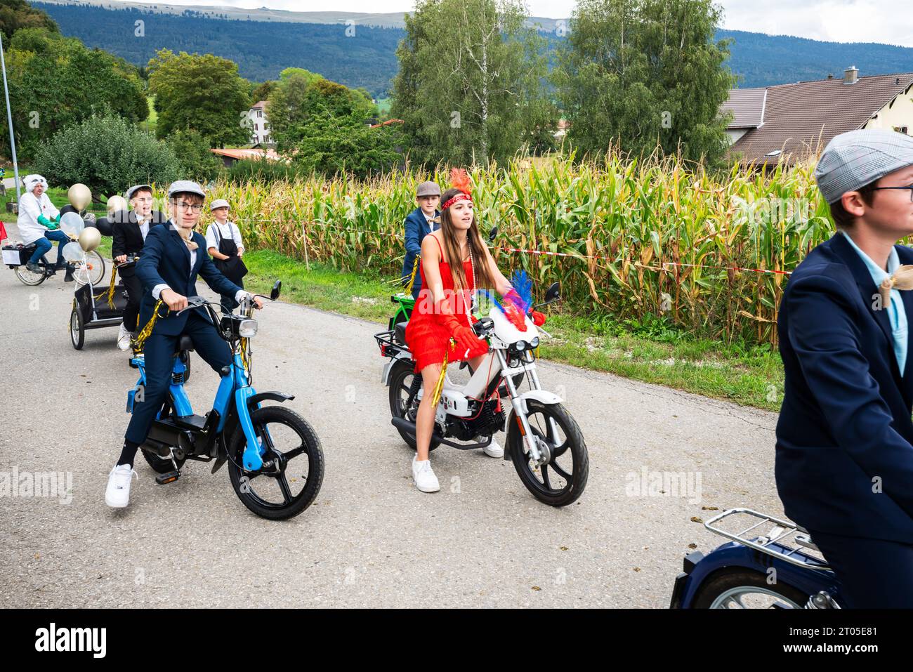 Villagers dressed in traditional costumes proudly take part in the ...