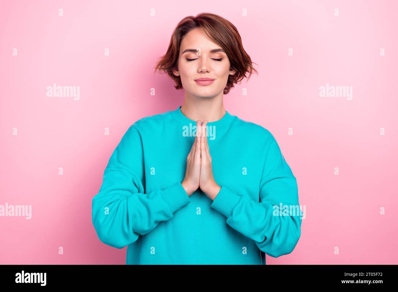 Portrait of candid calm kind girl two arms palms together pray peace in ...
