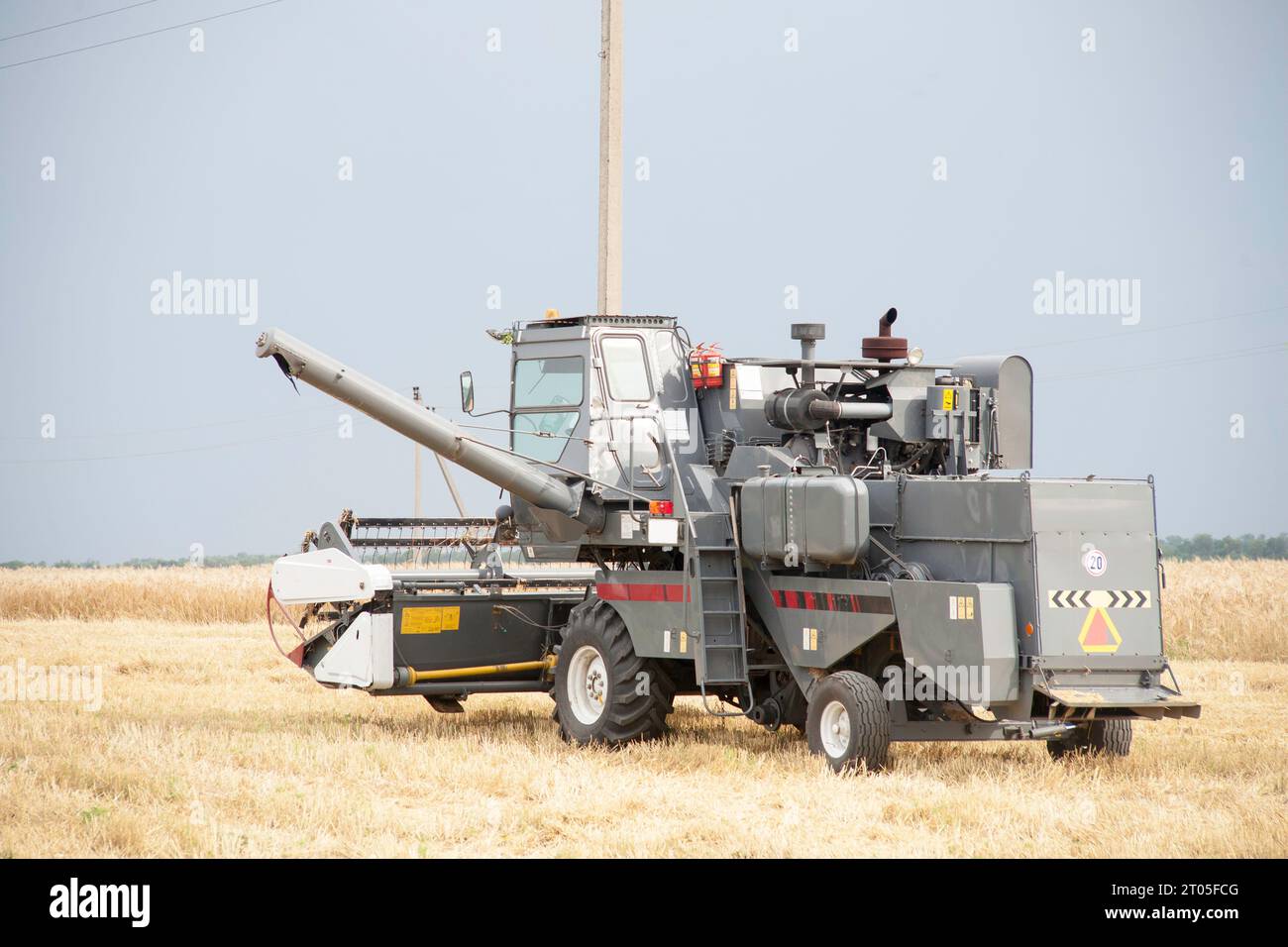 Old Russian grain harvester combine in the field. Russian combine ...