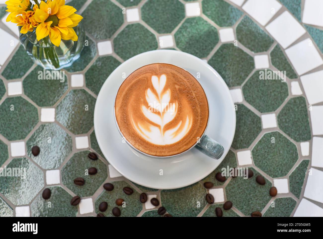 Cup of cappuccino with drawing on light gray background side view Stock ...