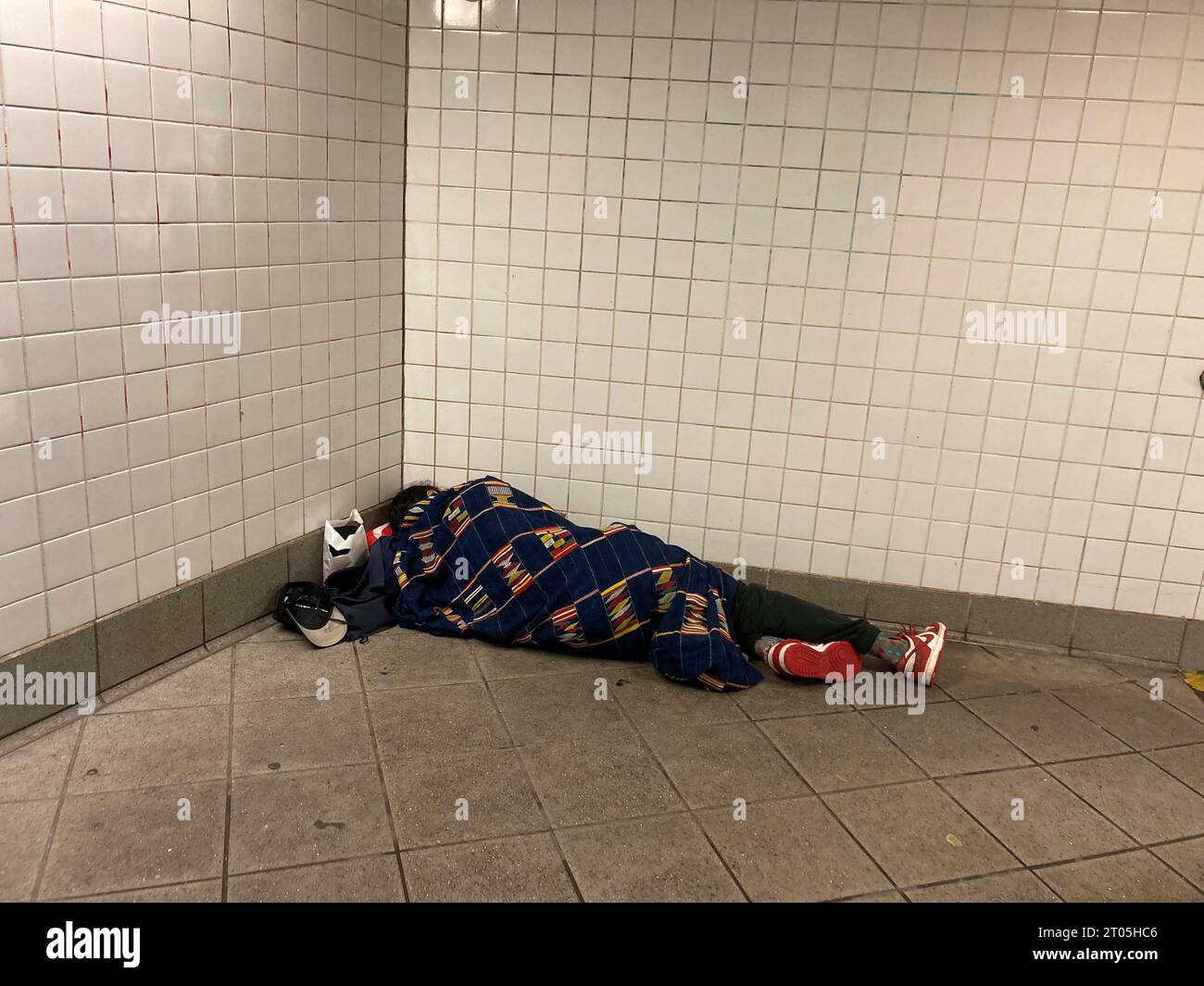 Homeless man sleeping in subway hi-res stock photography and images - Alamy