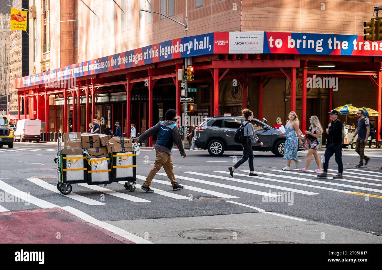 Amazon deliveries in the busy Midtown Manhattan intersection of West ...