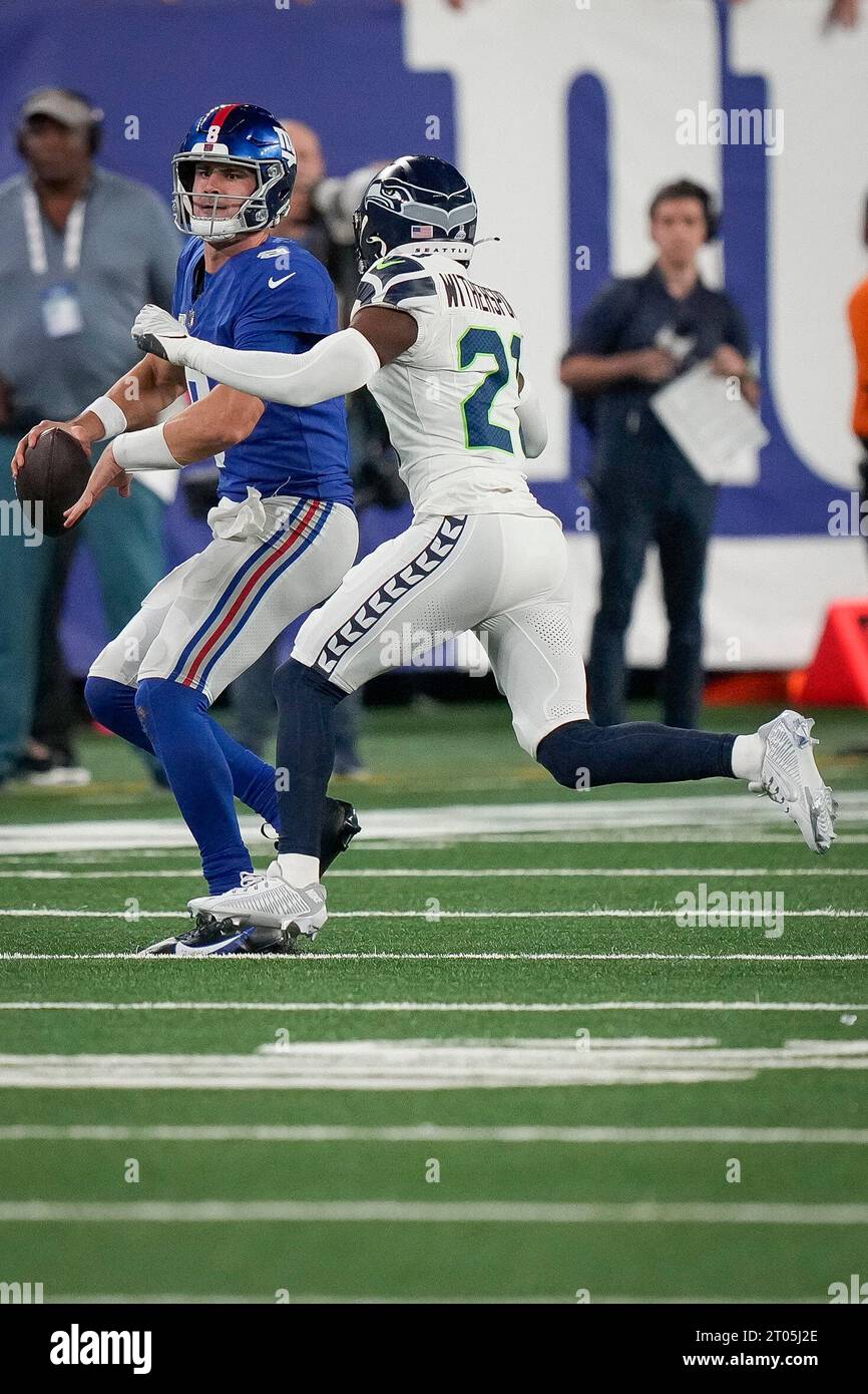 Seattle Seahawks cornerback Devon Witherspoon (21) chases down New York Giants quarterback ...