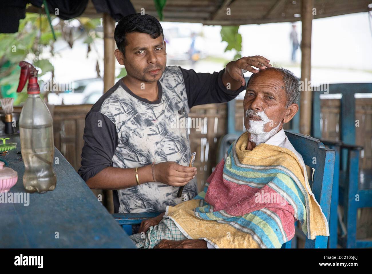 Barber shaving a customers face, barber shop, Assam, Northeast India ...
