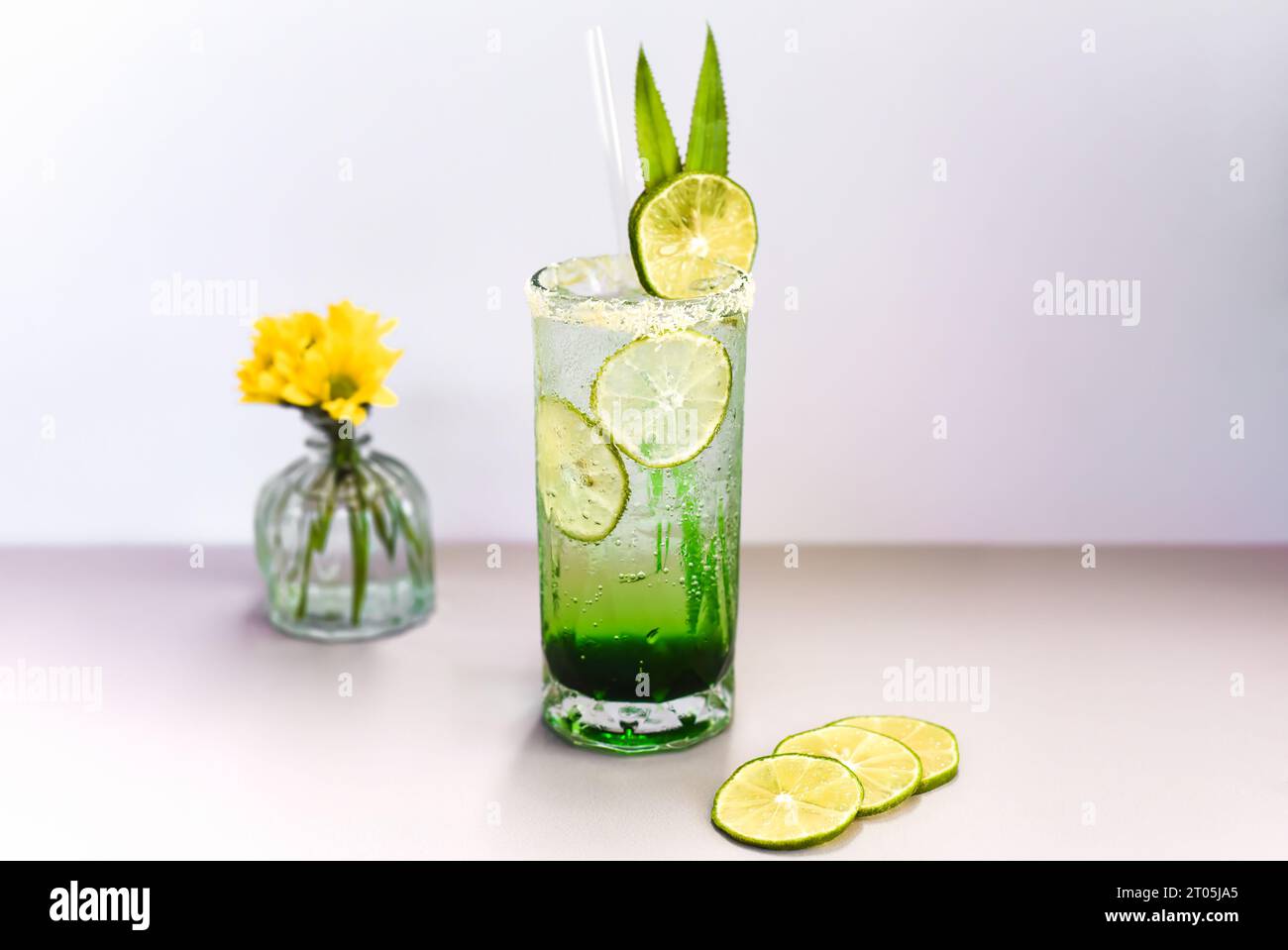 Panda leaves lemonade with desiccated coconut and green syrup on light ...