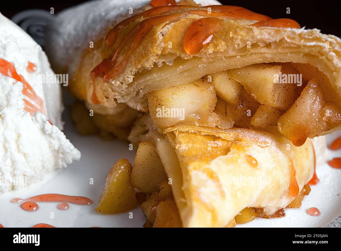 Baked strudel with apple, jam and ice cream Stock Photo - Alamy