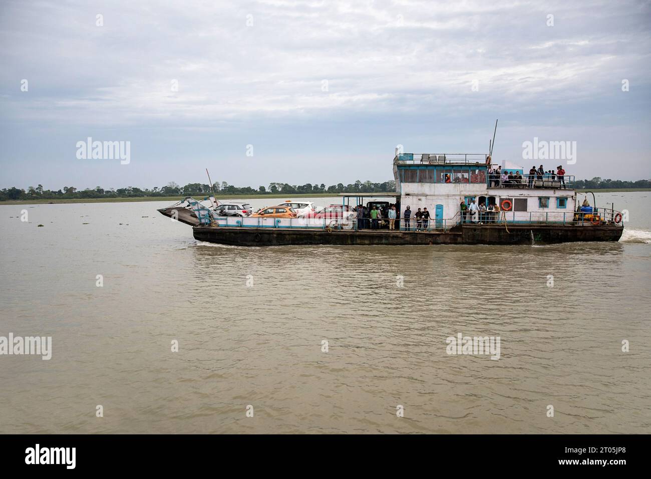 Local, not very safe small wooden ferry on Brahmaputra river ...