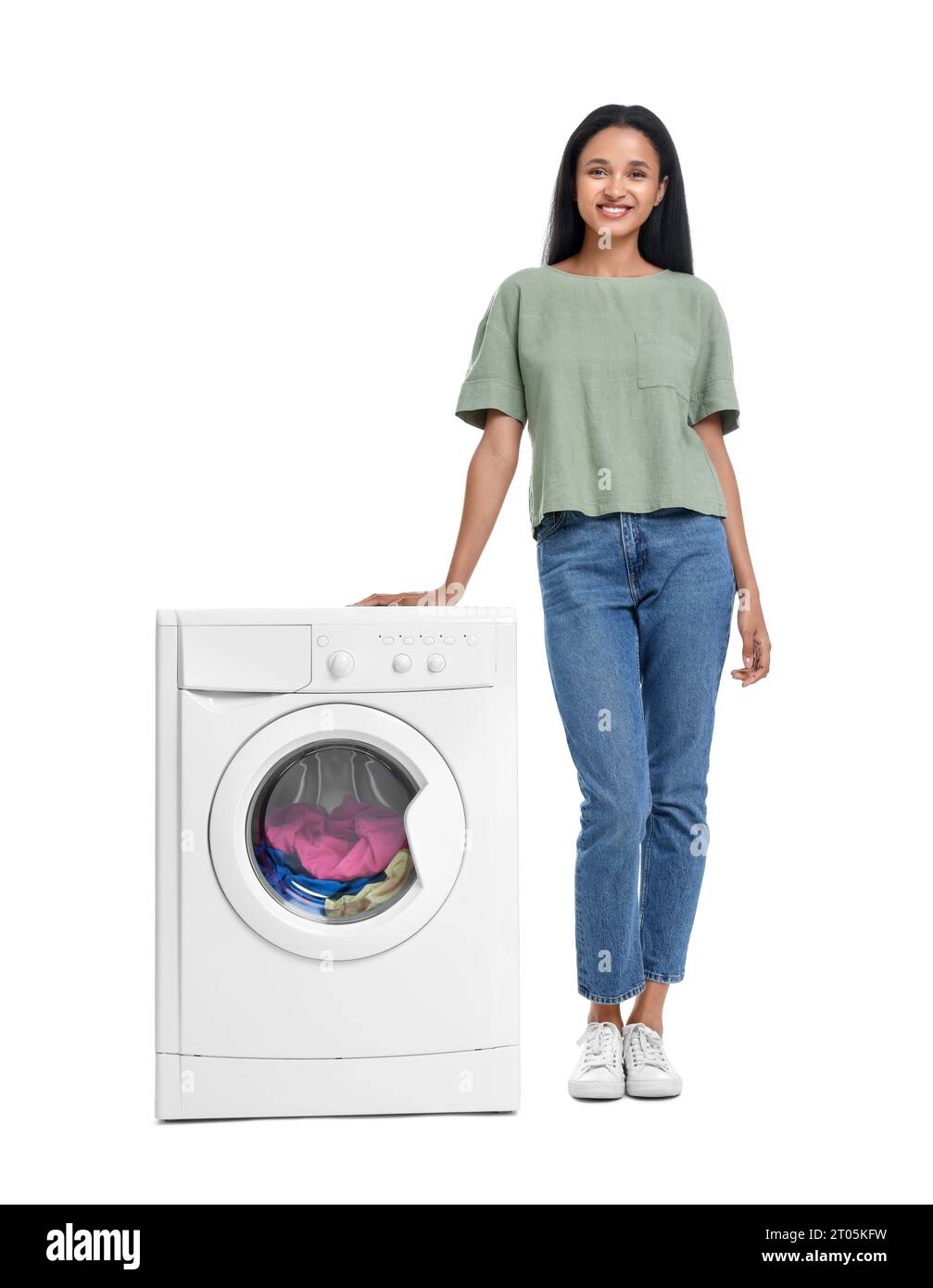 Beautiful woman near washing machine with laundry on white background Stock Photo - Alamy