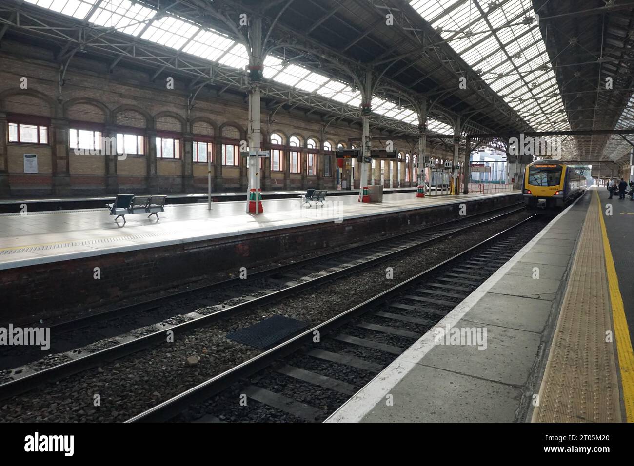 Train leaving station Stock Photo - Alamy