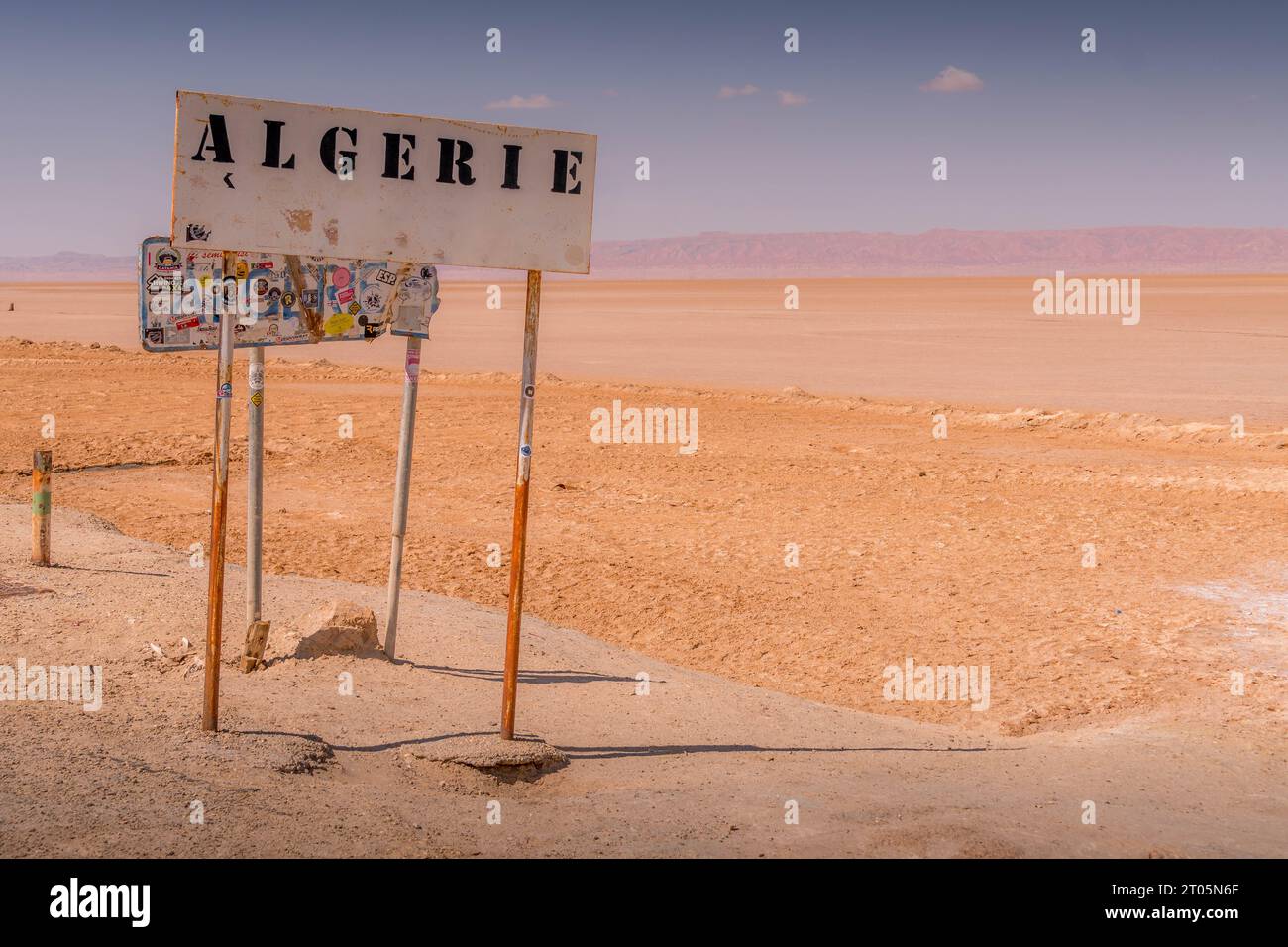 The sign "Algeria" on the border between Algeria and Tunisia in front ...
