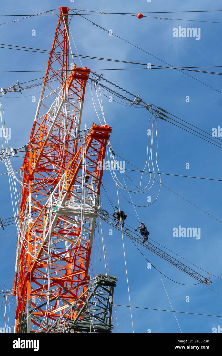 Assembly Of High Voltage Pylons Stock Photo - Alamy