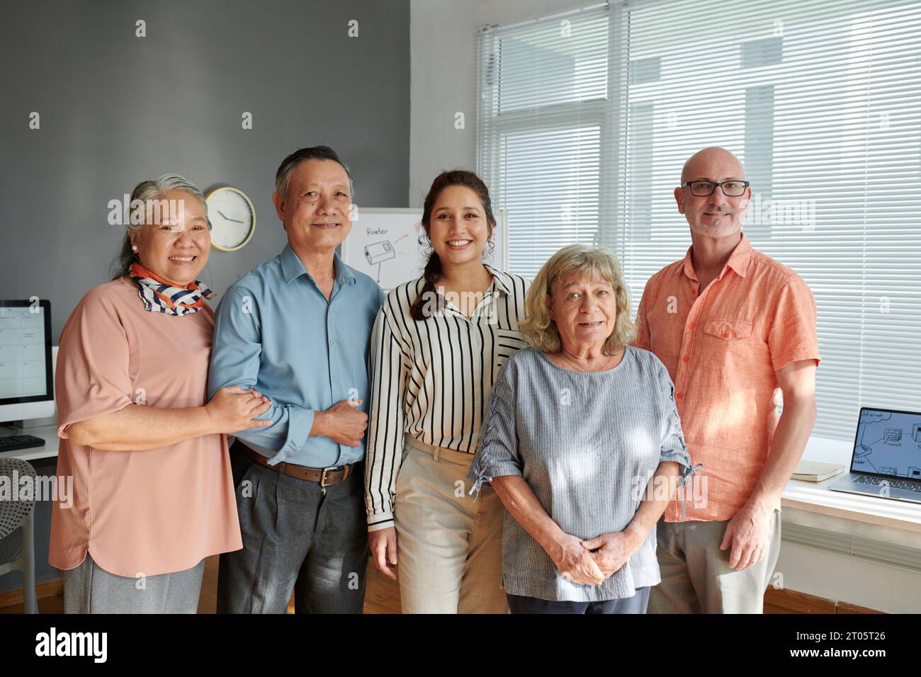 Group portrait of computer class teacher and her senior students ...