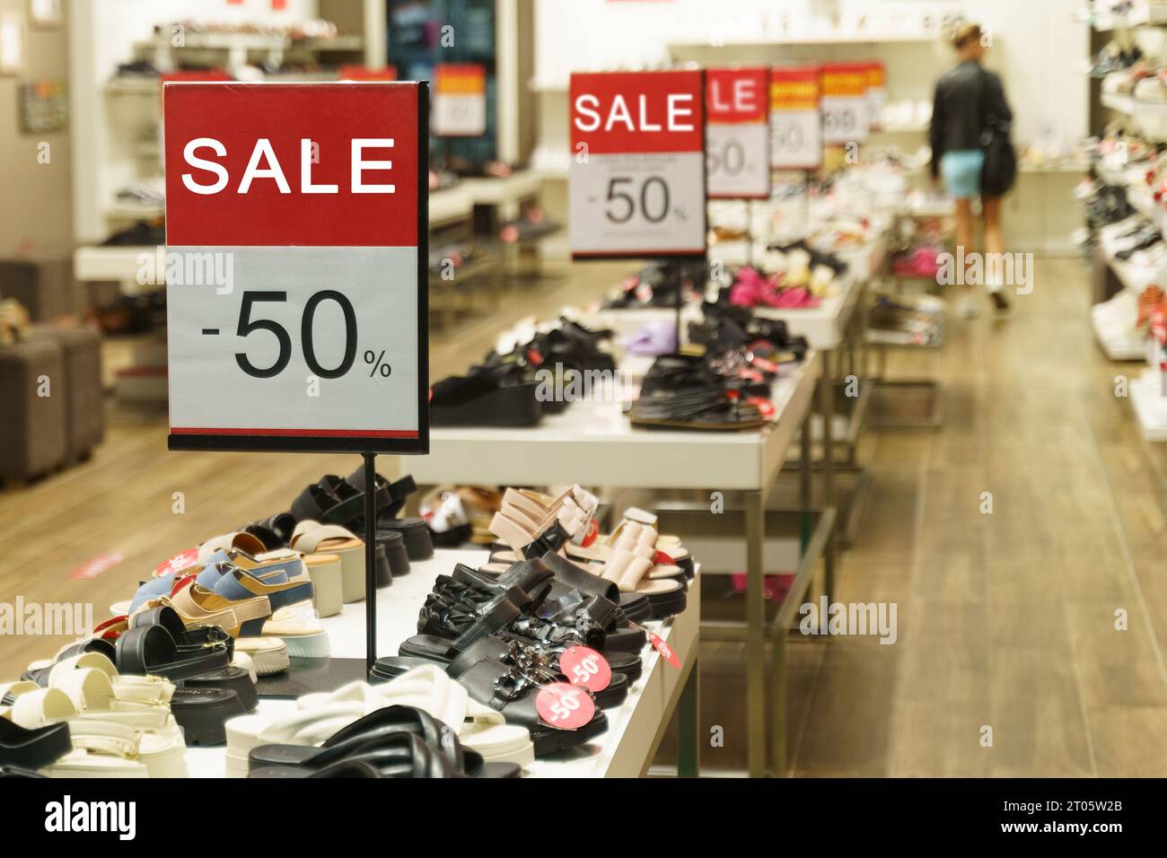 50 percent discount on shoes in a women's shoe store. Background image ...