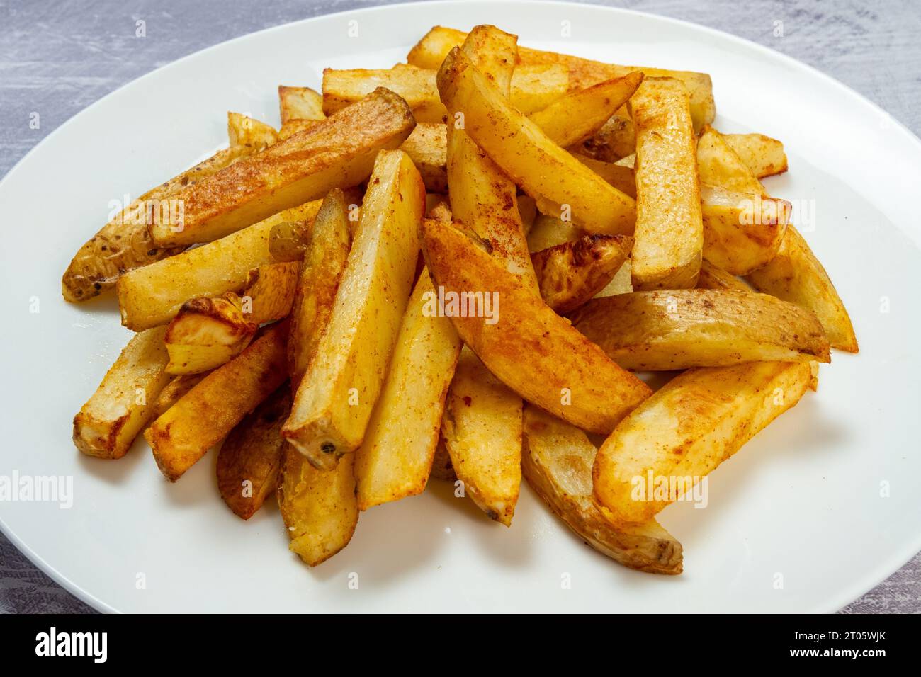 Home made skin on oven baked chips, close up Stock Photo - Alamy