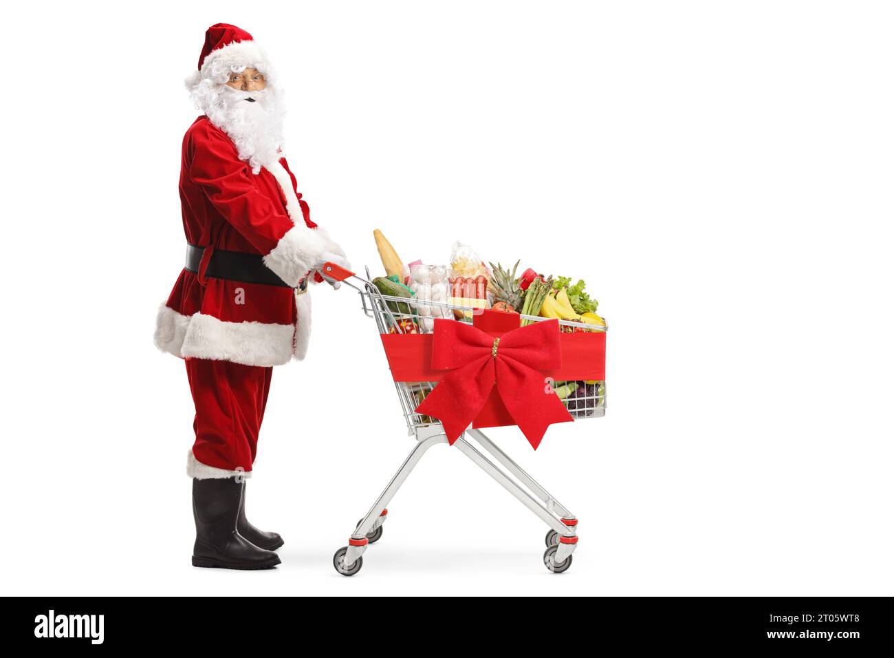 Full length shot of Santa Claus with a shopping cart tied with a red ...