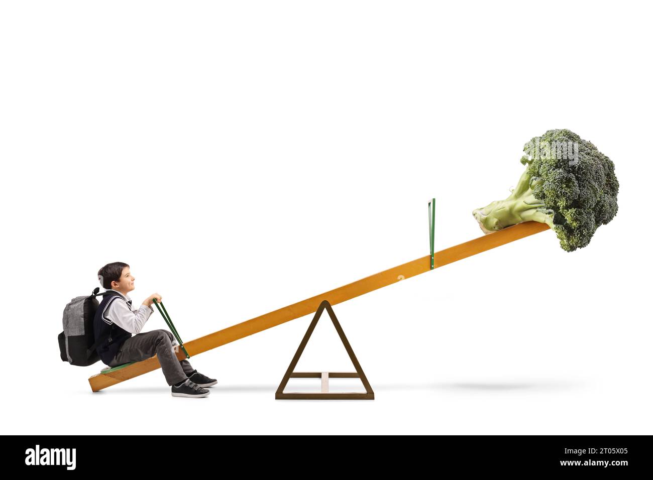 Boy and a big broccoli on a seesaw isolated on white background Stock ...