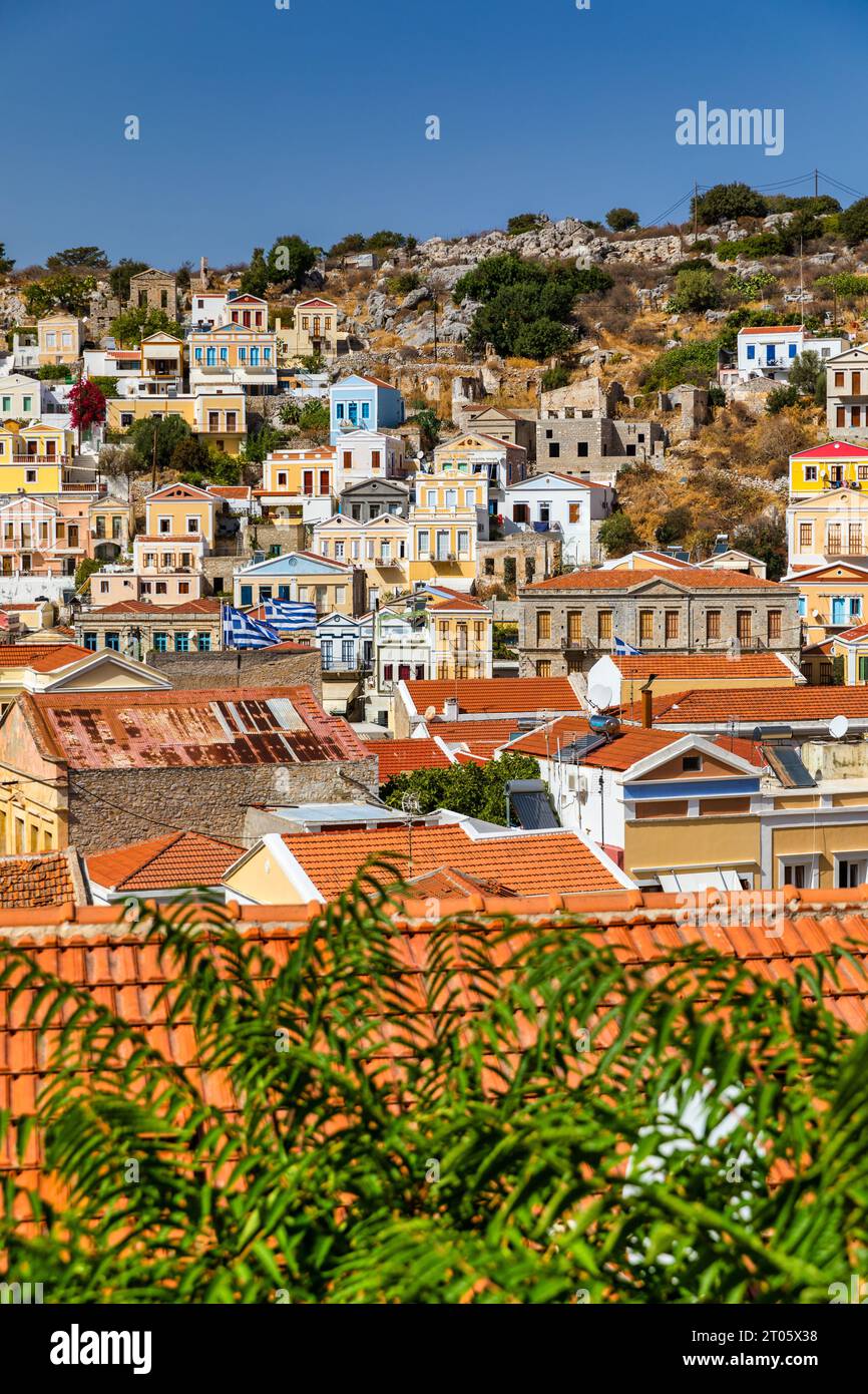 View of the beautiful greek island of Symi (Simi) with colourful houses ...