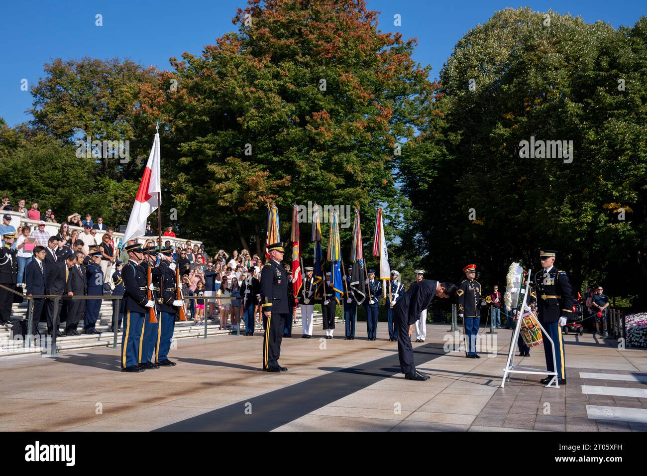 Minoru Kihara, Minister of Defense of Japan, bows after placing a ...