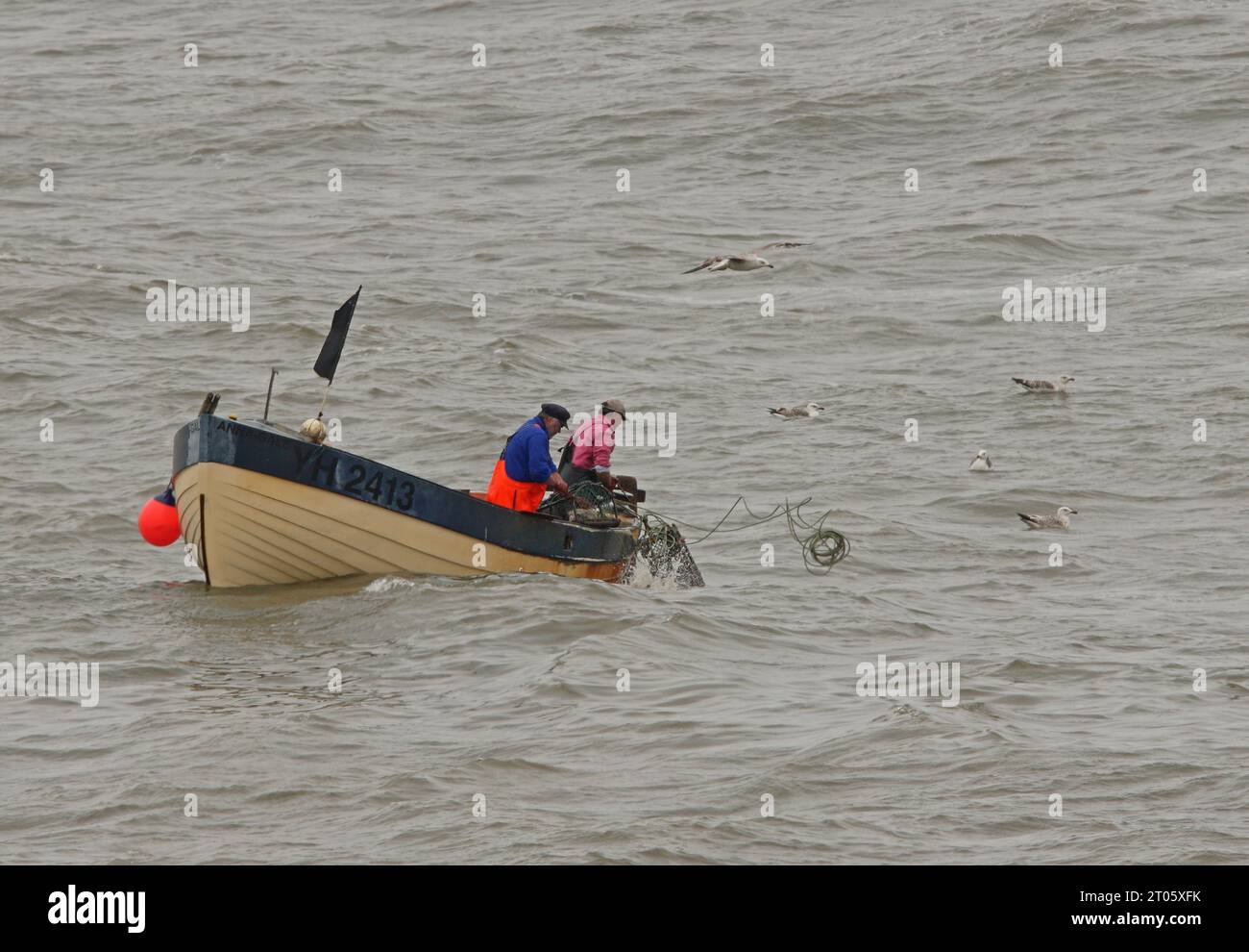 fishermen raising crab pots Weybourne, Norfolk, UK. May Stock Photo - Alamy