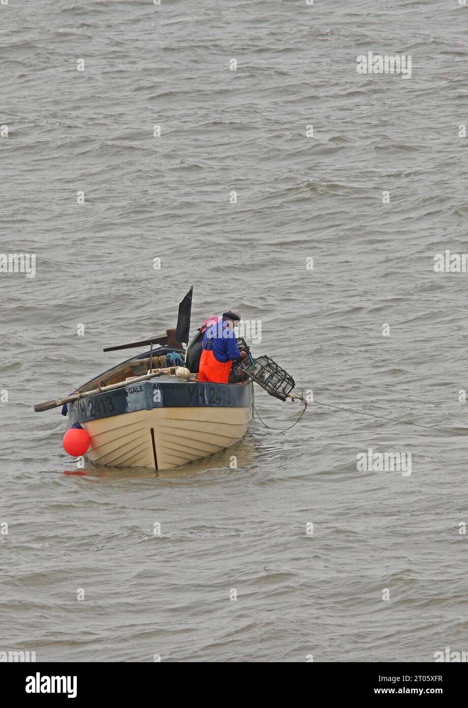 fishermen raising crab pots Weybourne, Norfolk, UK. May Stock Photo - Alamy