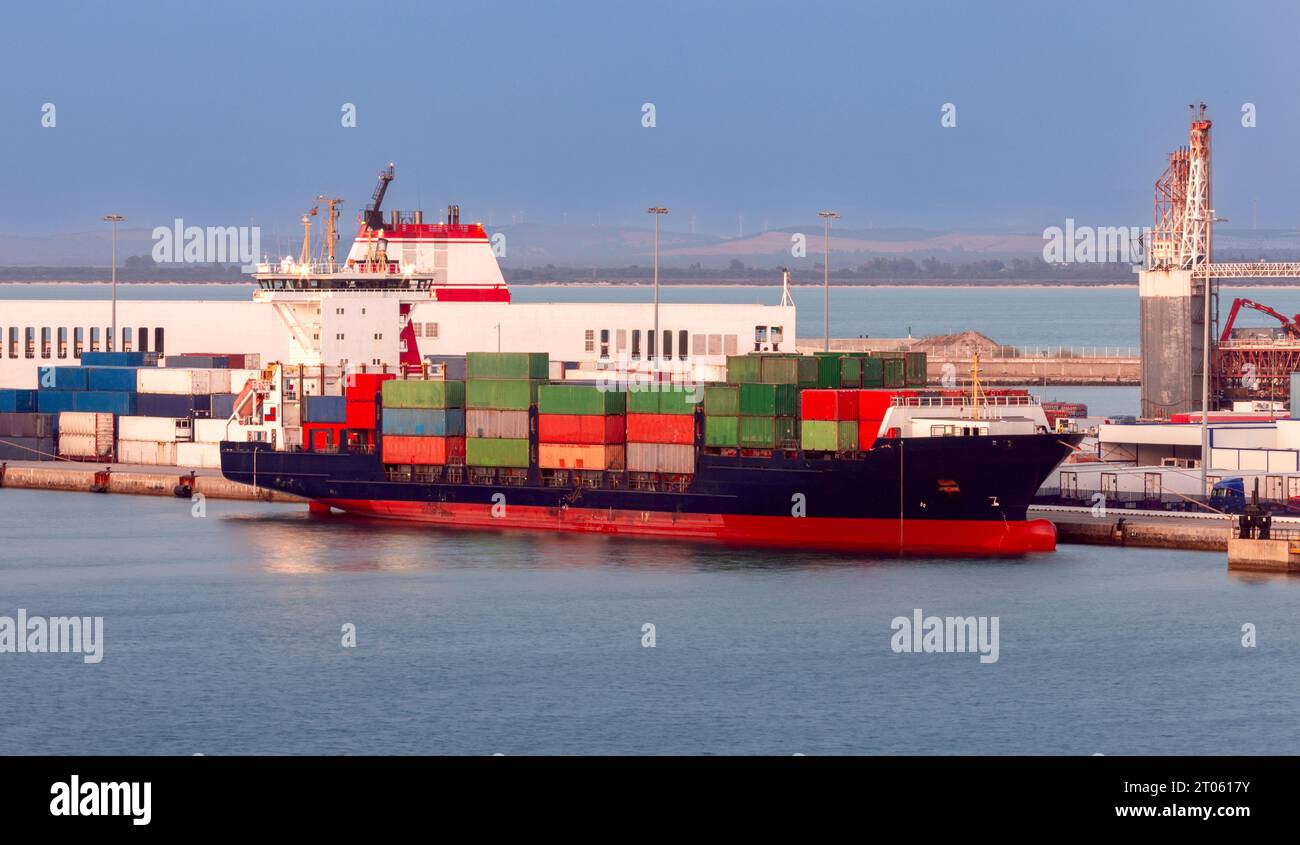 Large sea container ship with containers in the cargo port of Cadiz ...