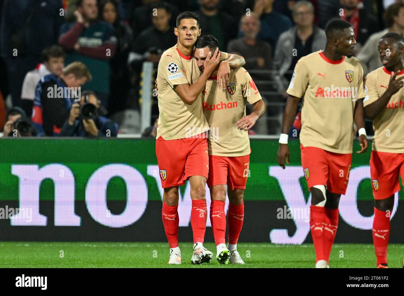 Adrien Thomasson (28) of RC Lens celebrates with Florian Sotoca (7) of ...