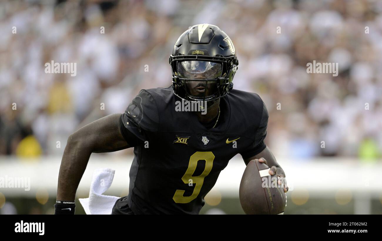 Central Florida quarterback Timmy McClain (9) scrambles for yardage ...