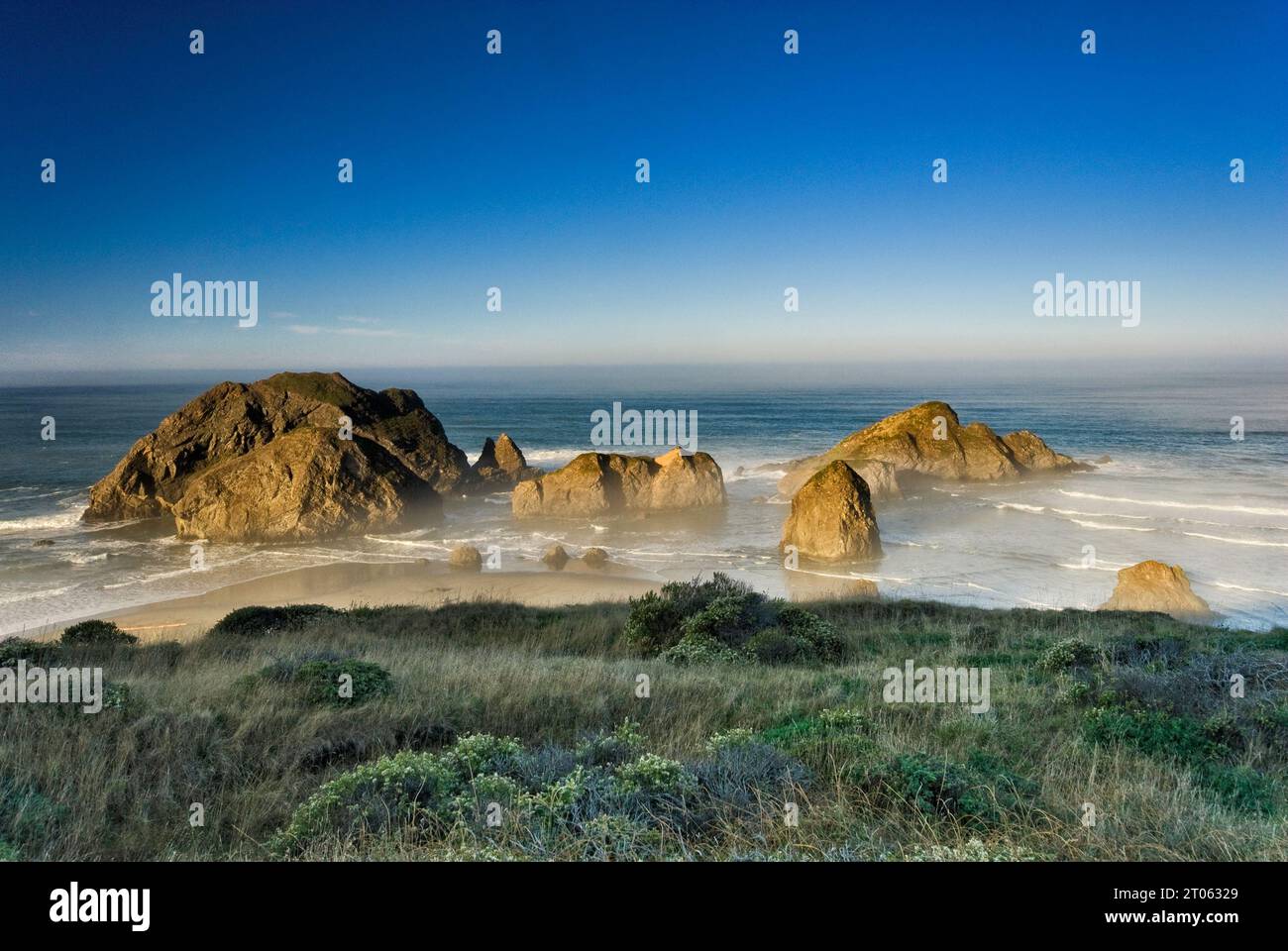 Rocks on Meyers Creek Beach in Pistol River State Park shrouded in fog ...