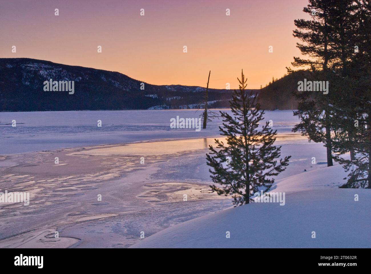 Frozen Paulina Lake in caldera of Newberry Crater volcano at sunrise in ...