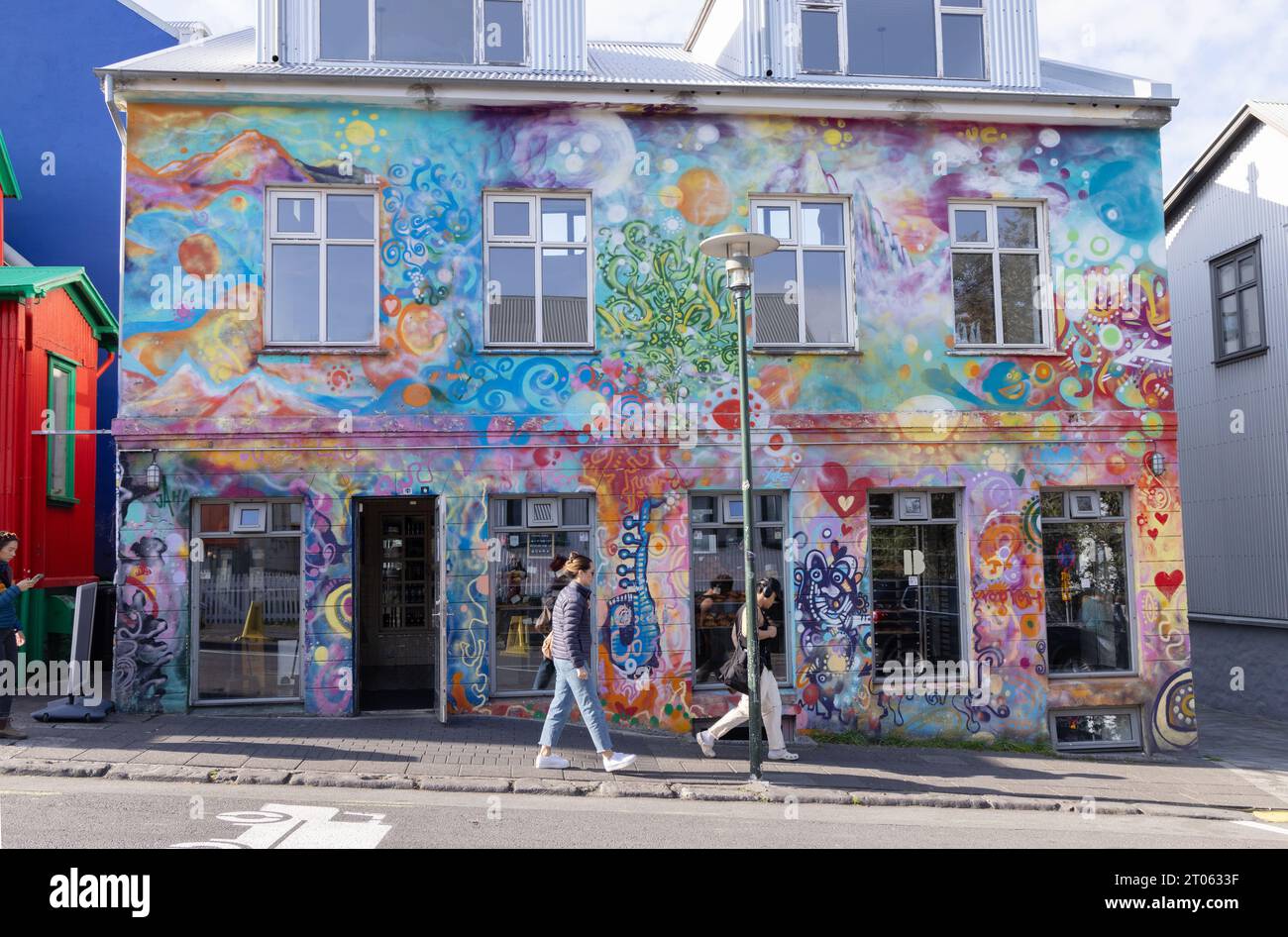 Reykjavik street art; Colourful painted building in a street scene ...