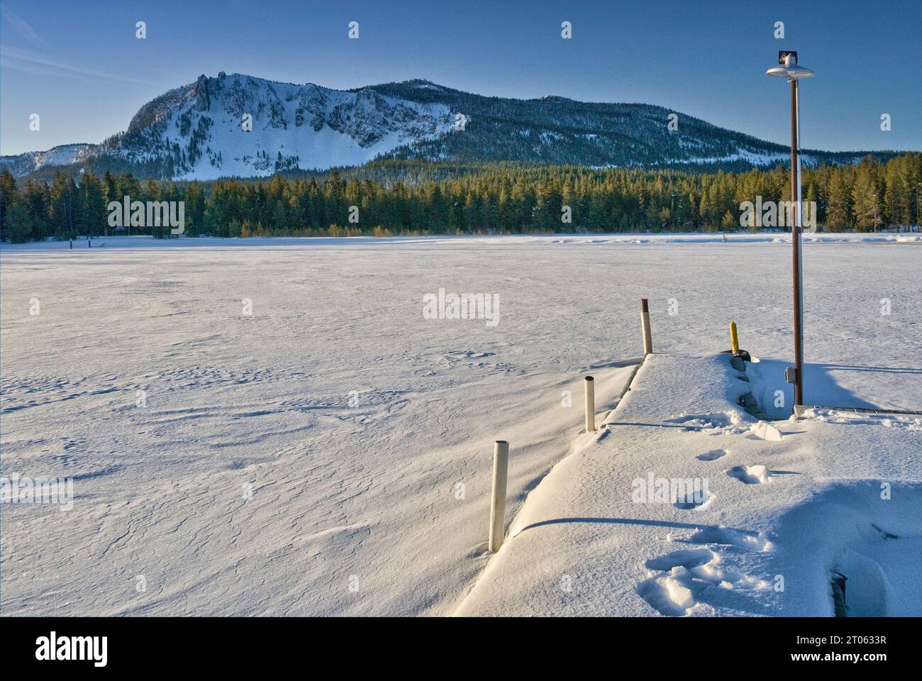 Frozen Paulina Lake in caldera of Newberry Crater volcano at sunrise in ...