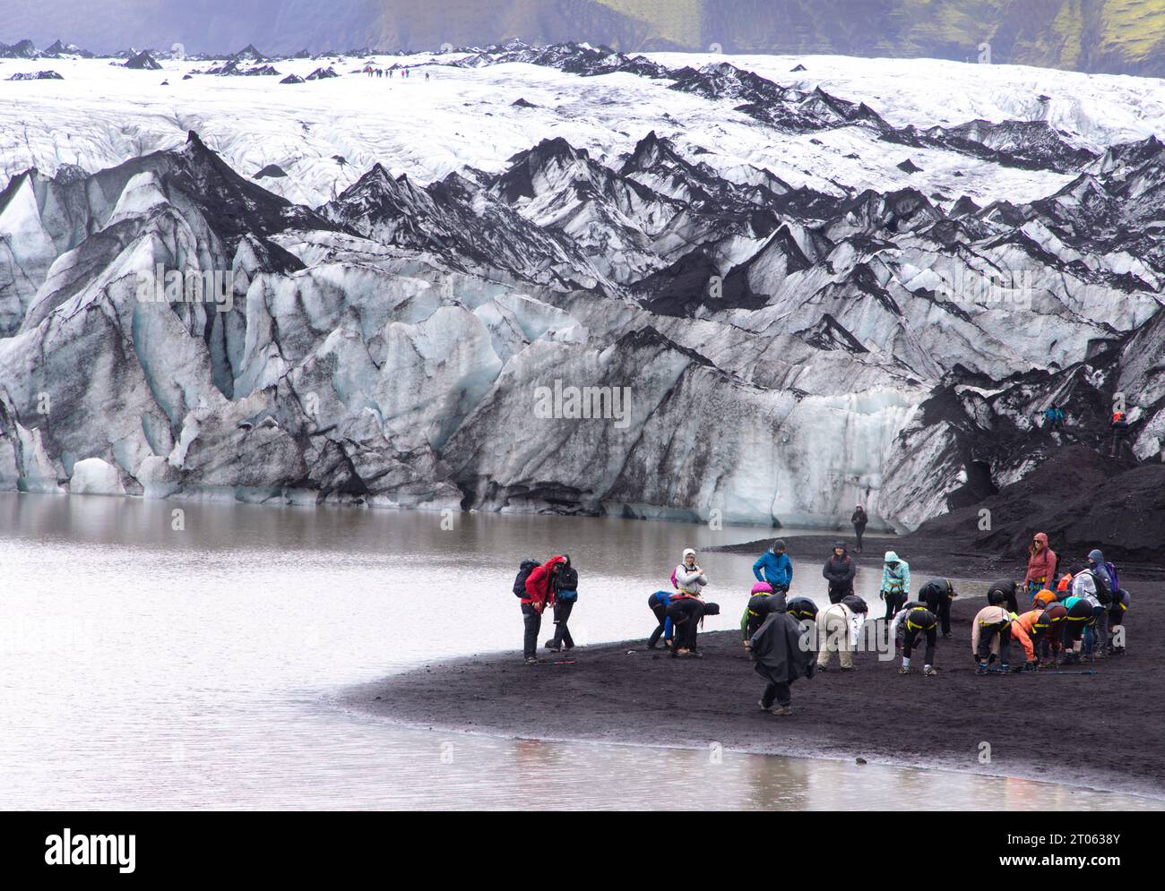 Iceland tourism - tourists at Sólheimajökull Glacier, part of the ...