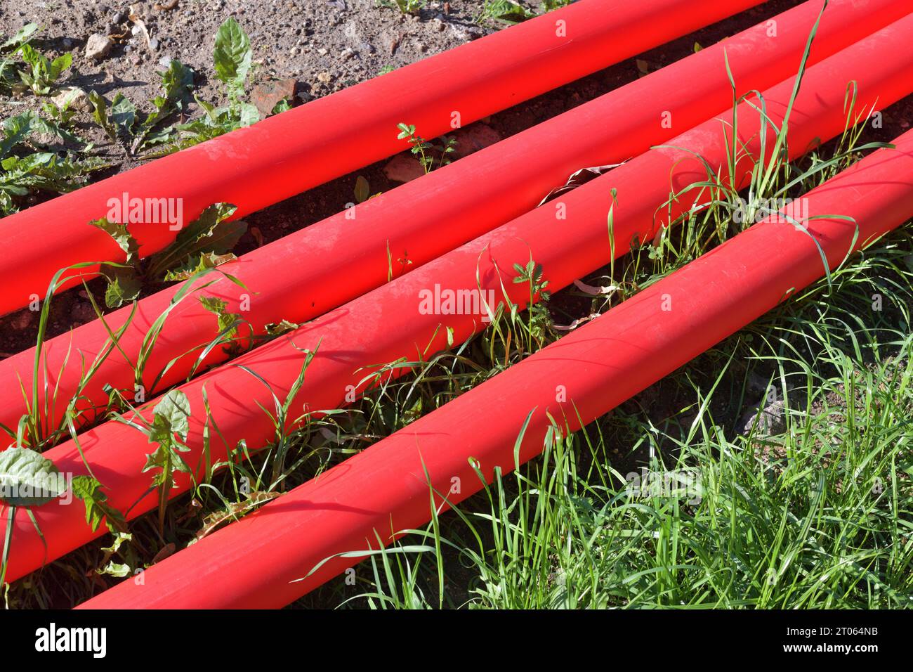 Cable protective pipe lying on ground Stock Photo - Alamy