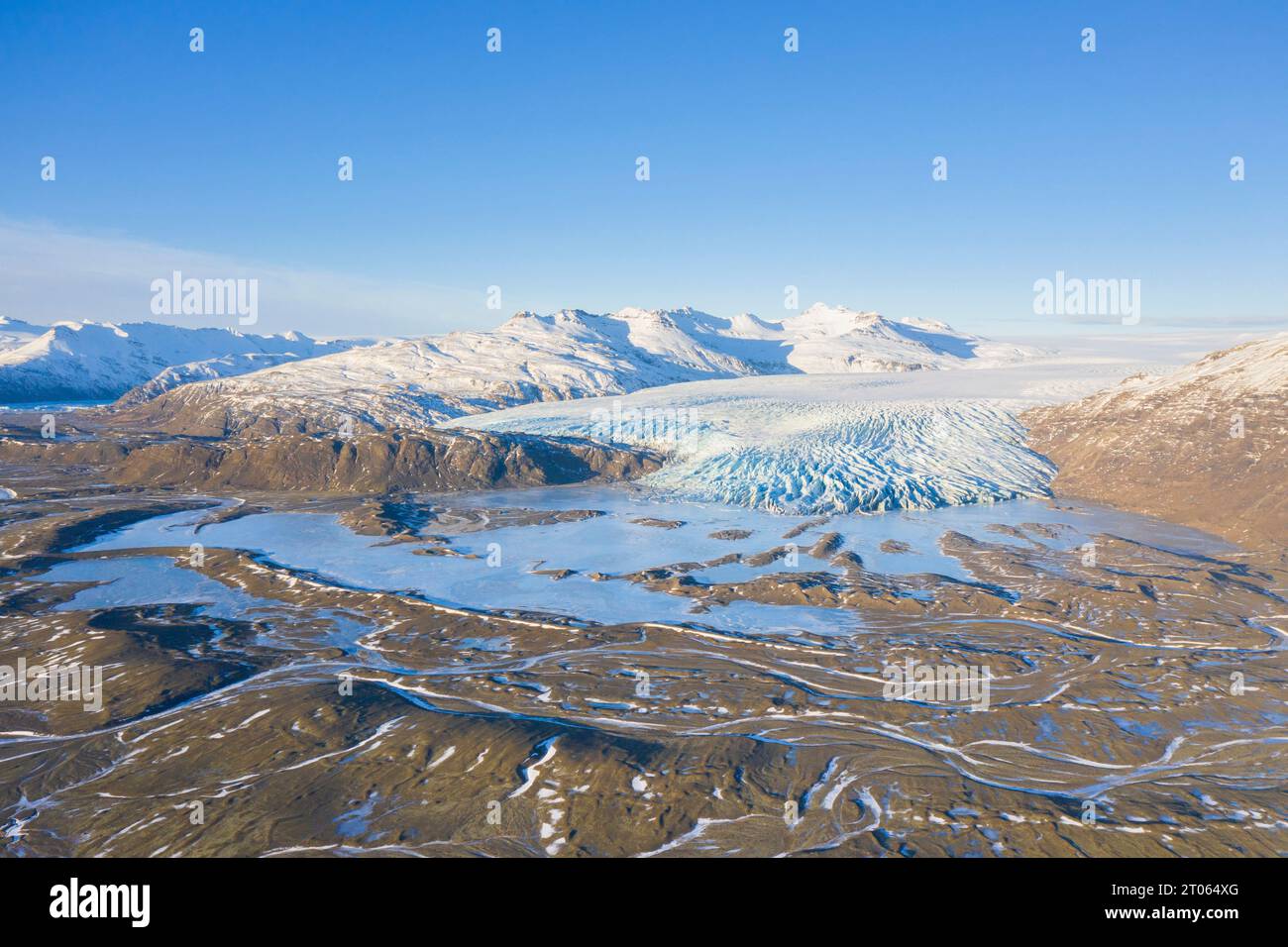 Aerial view over ice tongue Falljökull in winter, one of many outlet ...