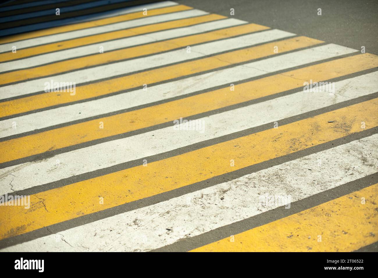Pedestrian crossing on the road. Pedestrian markings. Yellow and white ...