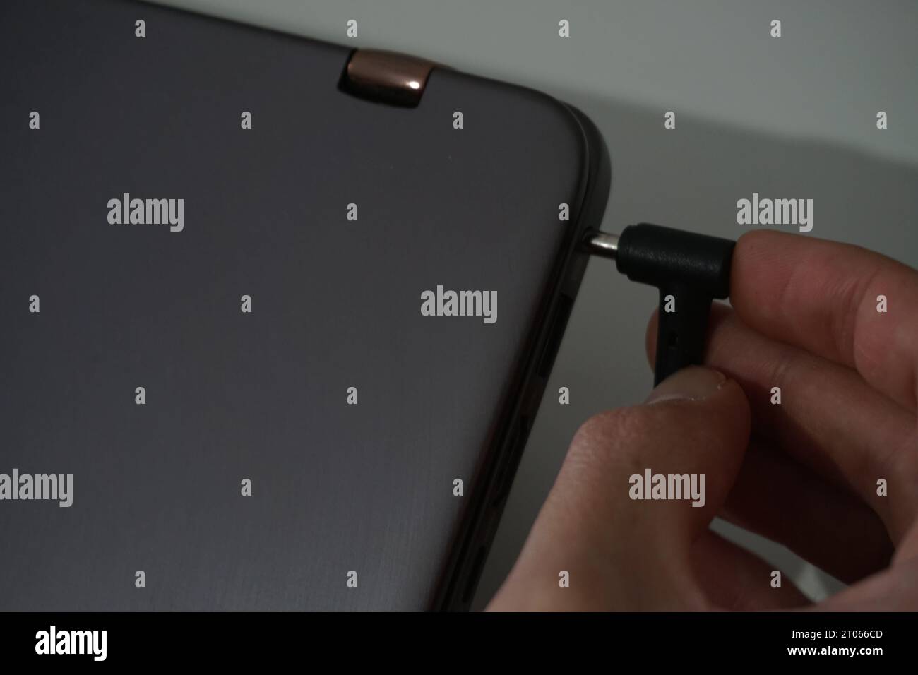 charging electronic devices with cable Stock Photo - Alamy