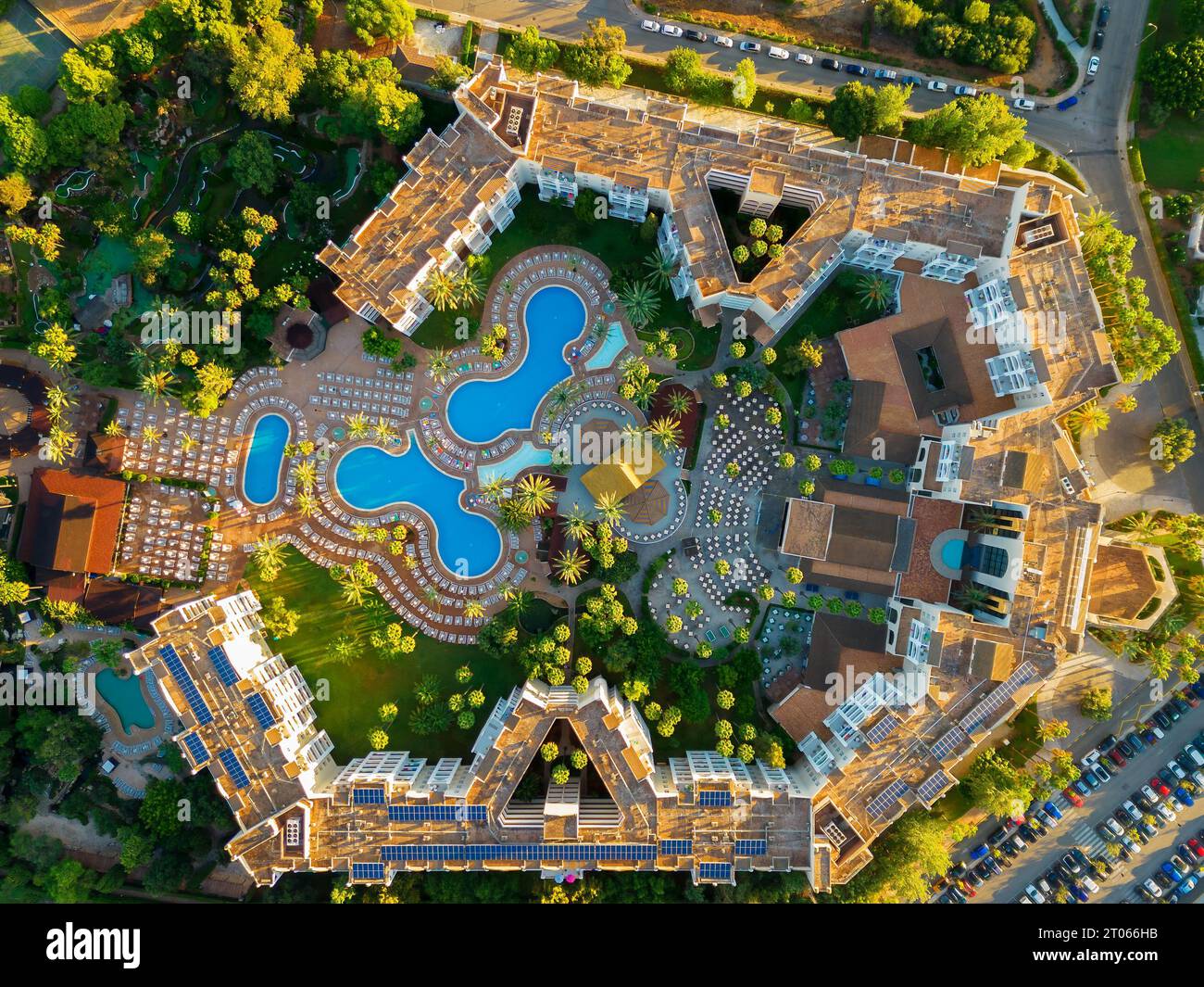 Aerial view from drone of coastal resort with swimming pools during ...