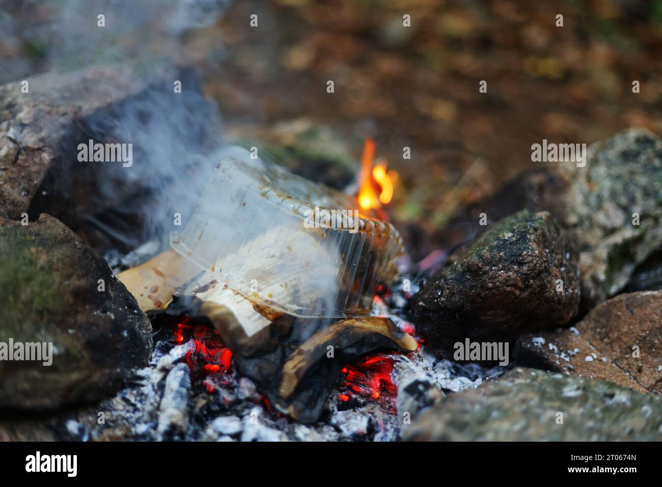 plastic box burns in a fire Stock Photo - Alamy