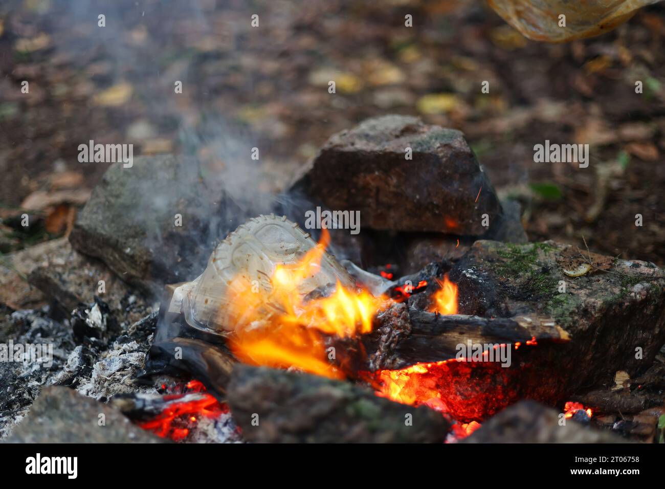 plastic box burns in a fire Stock Photo - Alamy